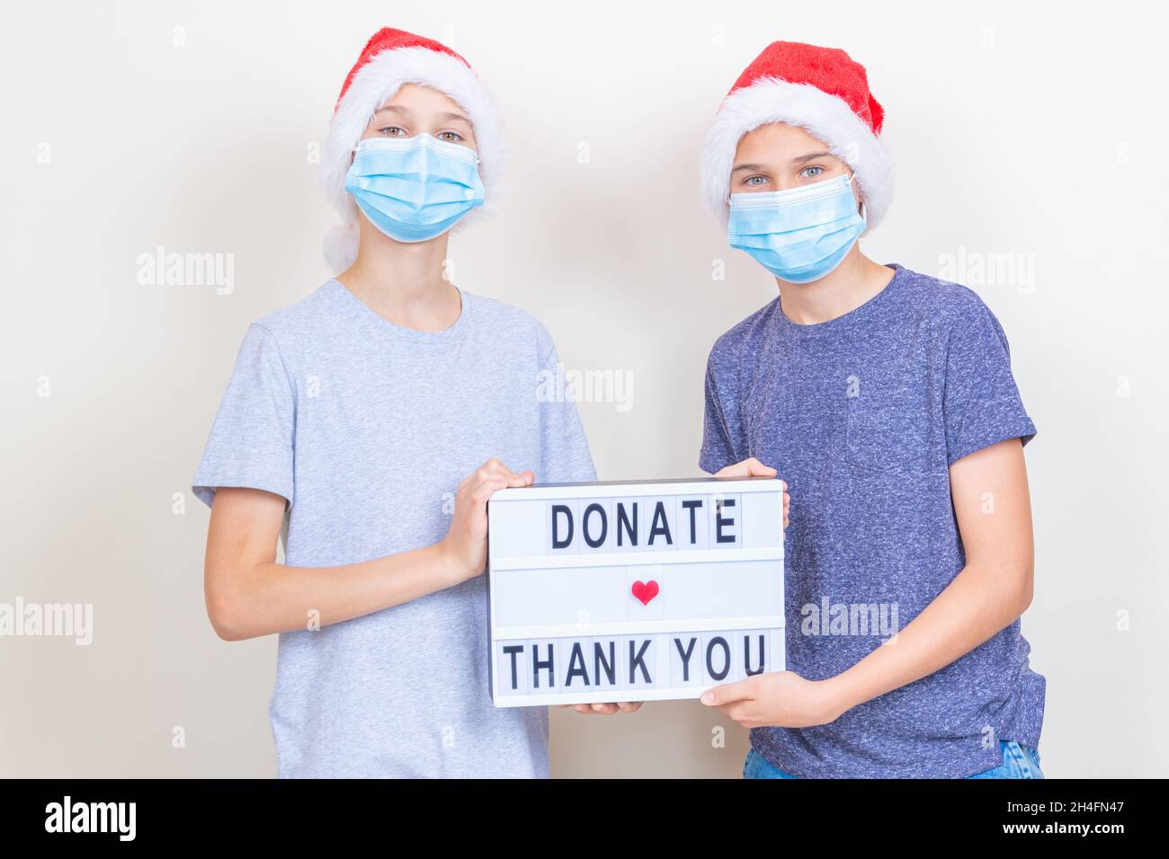 Boy helping charity hi-res stock photography and images - Alamy