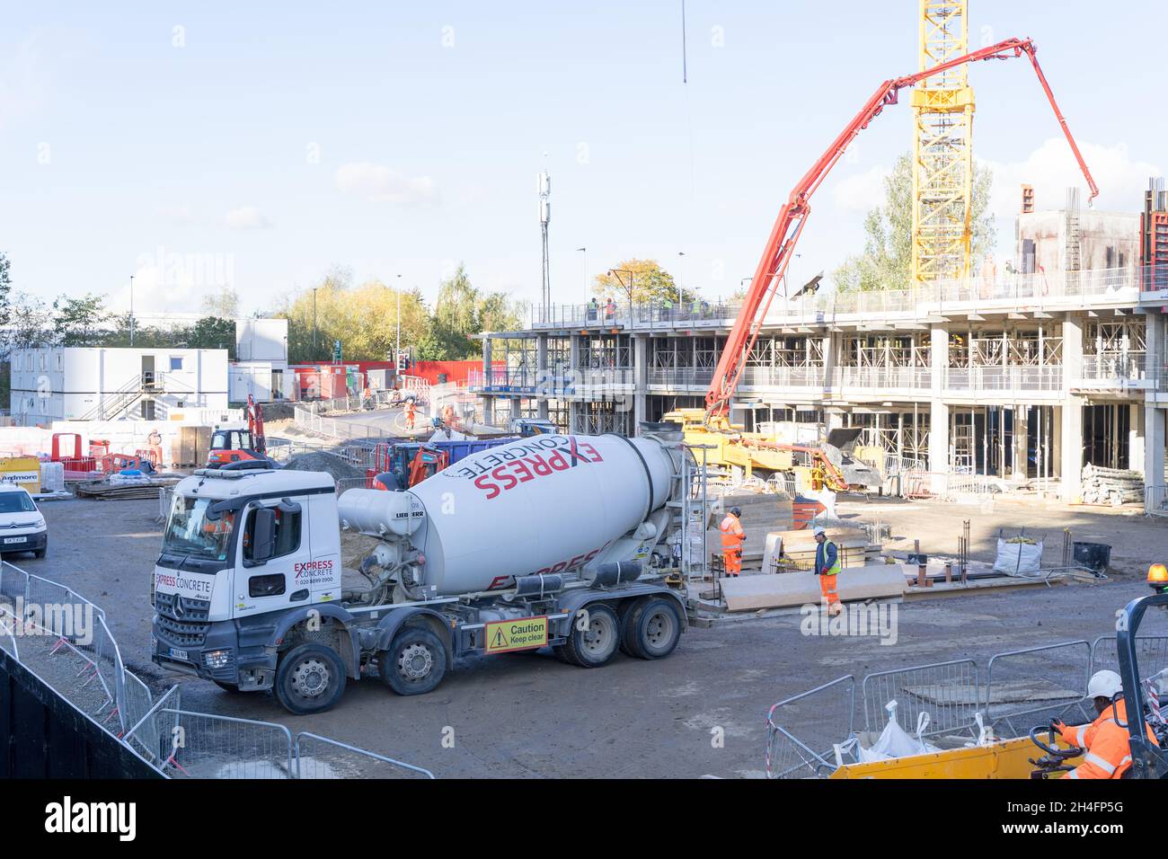 Express concrete truck is feeding the concrete pump for the new floor ...