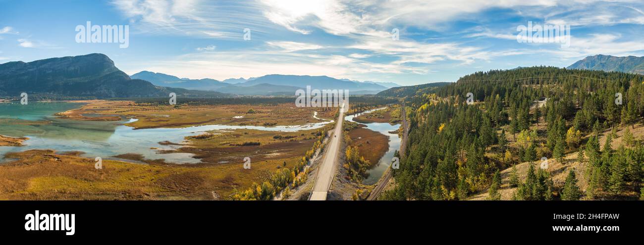Aerial panoramic view of a scenic highway around mountains Stock Photo ...