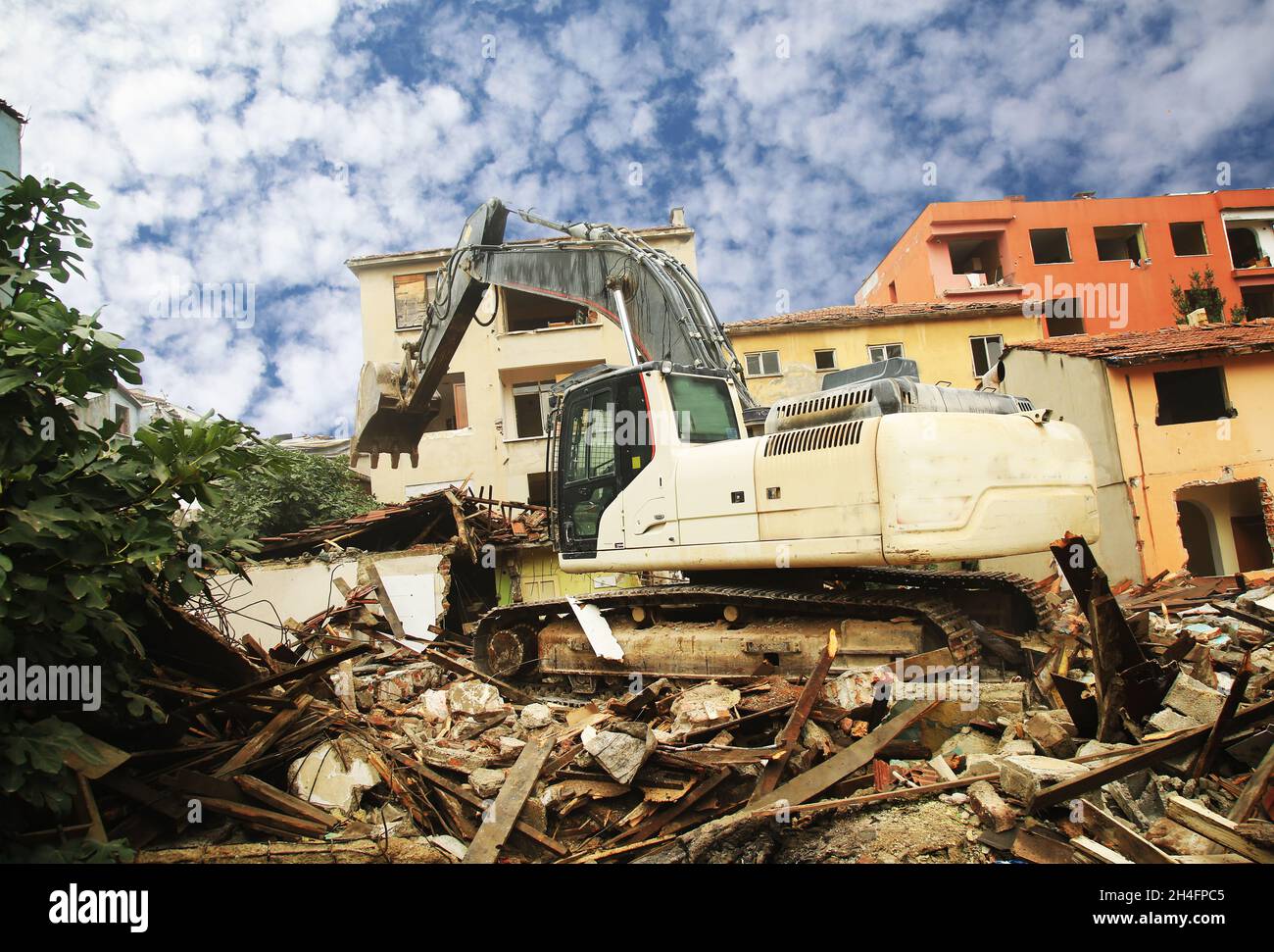 Excavators working on huge demolition site. Construction machinery ...