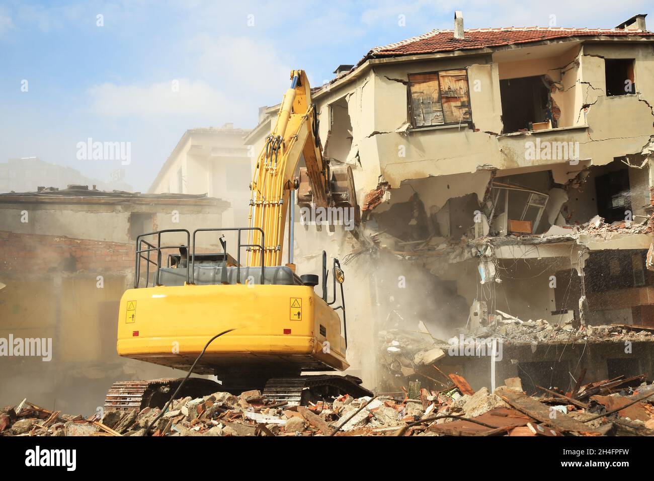 Excavators working on huge demolition site. Construction machinery ...