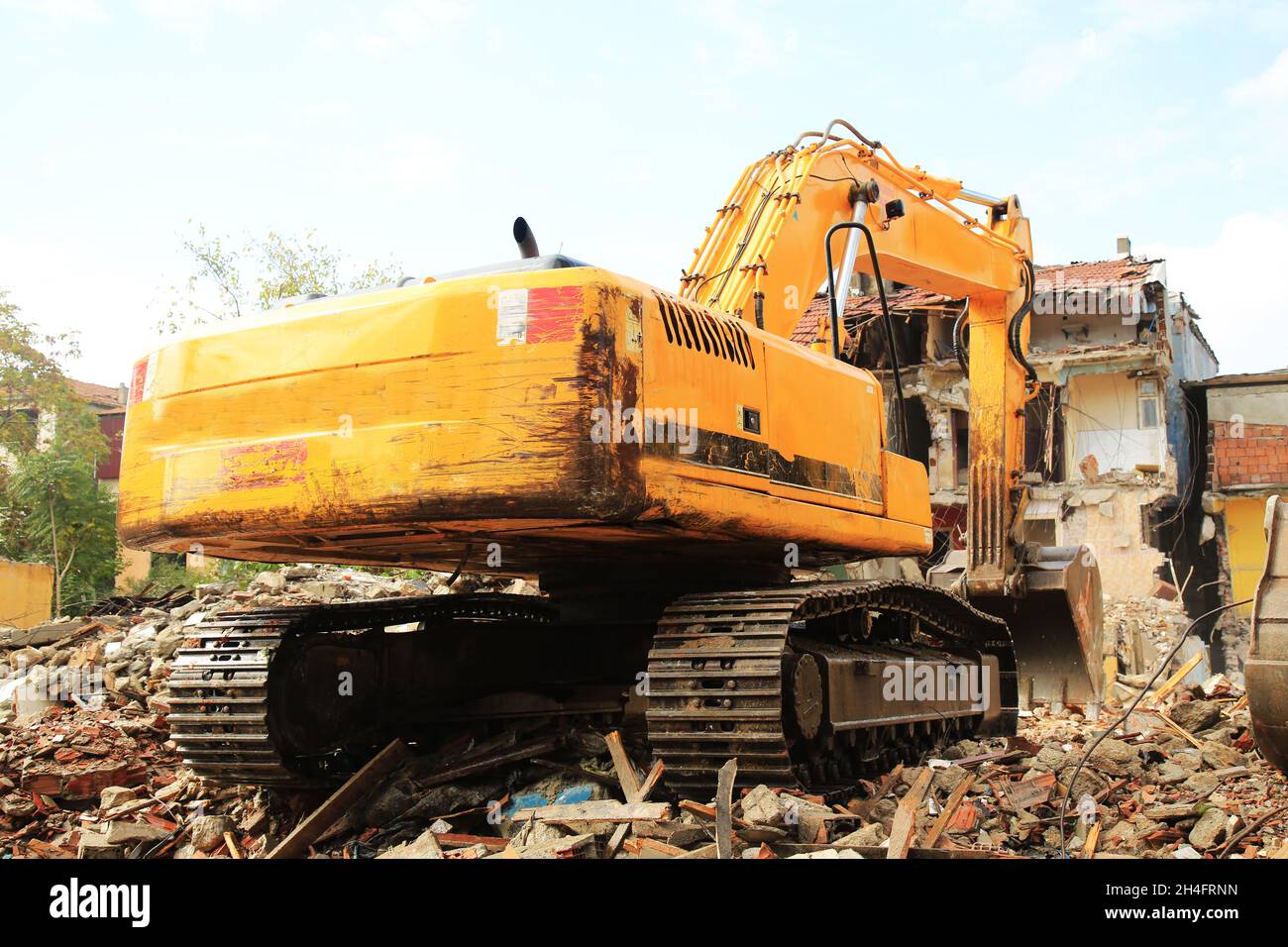 Excavators working on huge demolition site. Construction machinery ...