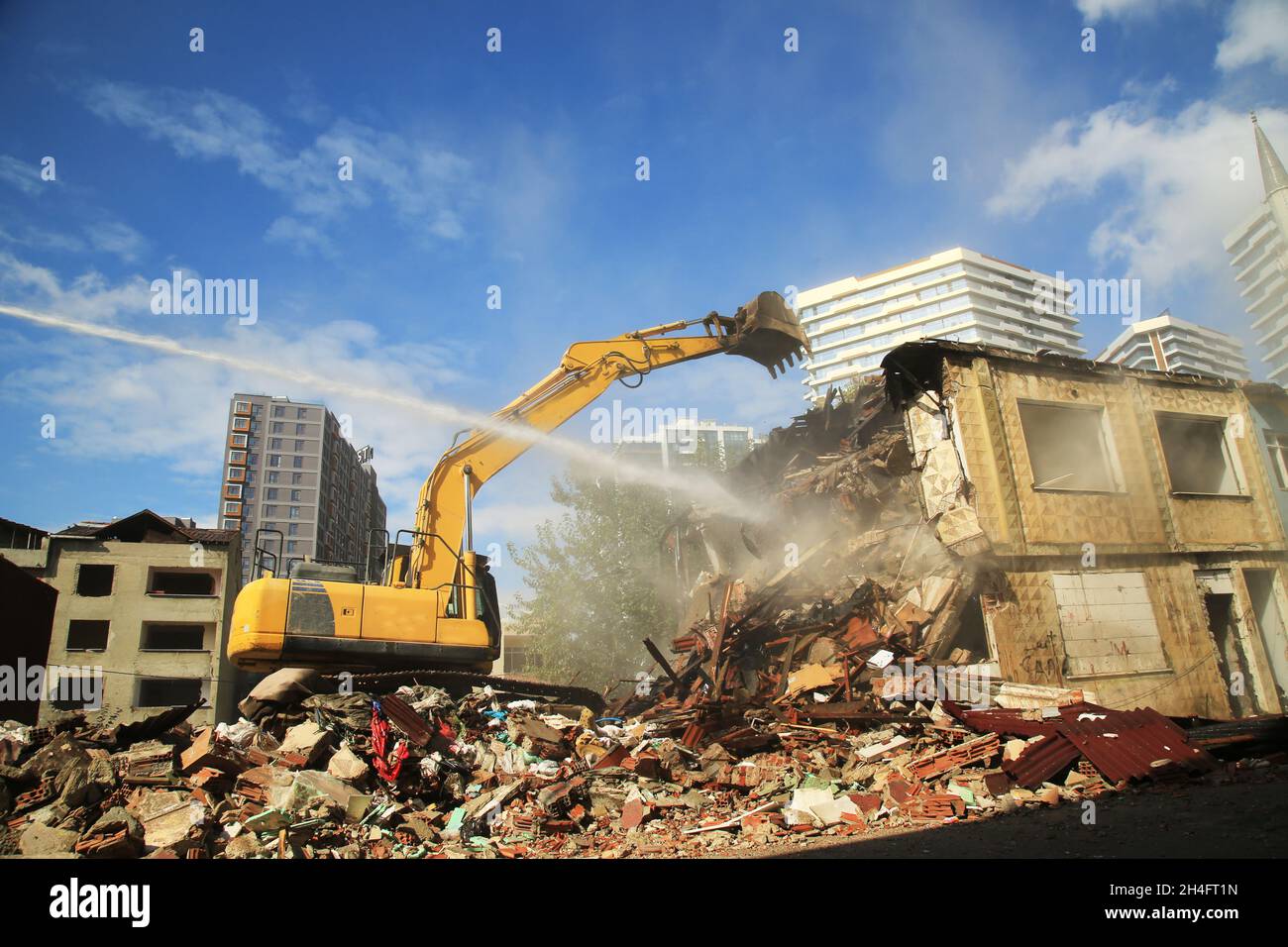 Excavators working on huge demolition site. Construction machinery ...