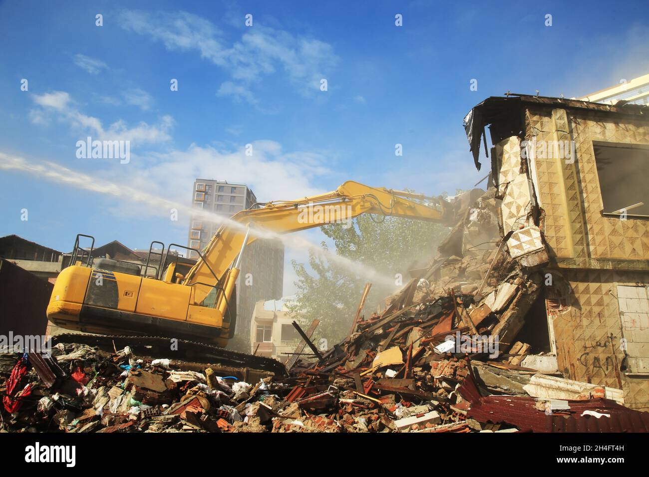 Excavators working on huge demolition site. Construction machinery ...