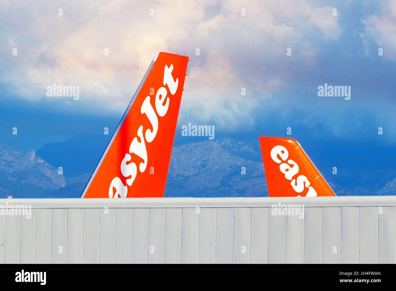 close up of tail fin graphics logo livery Easy Jet aircraft on ramp ...