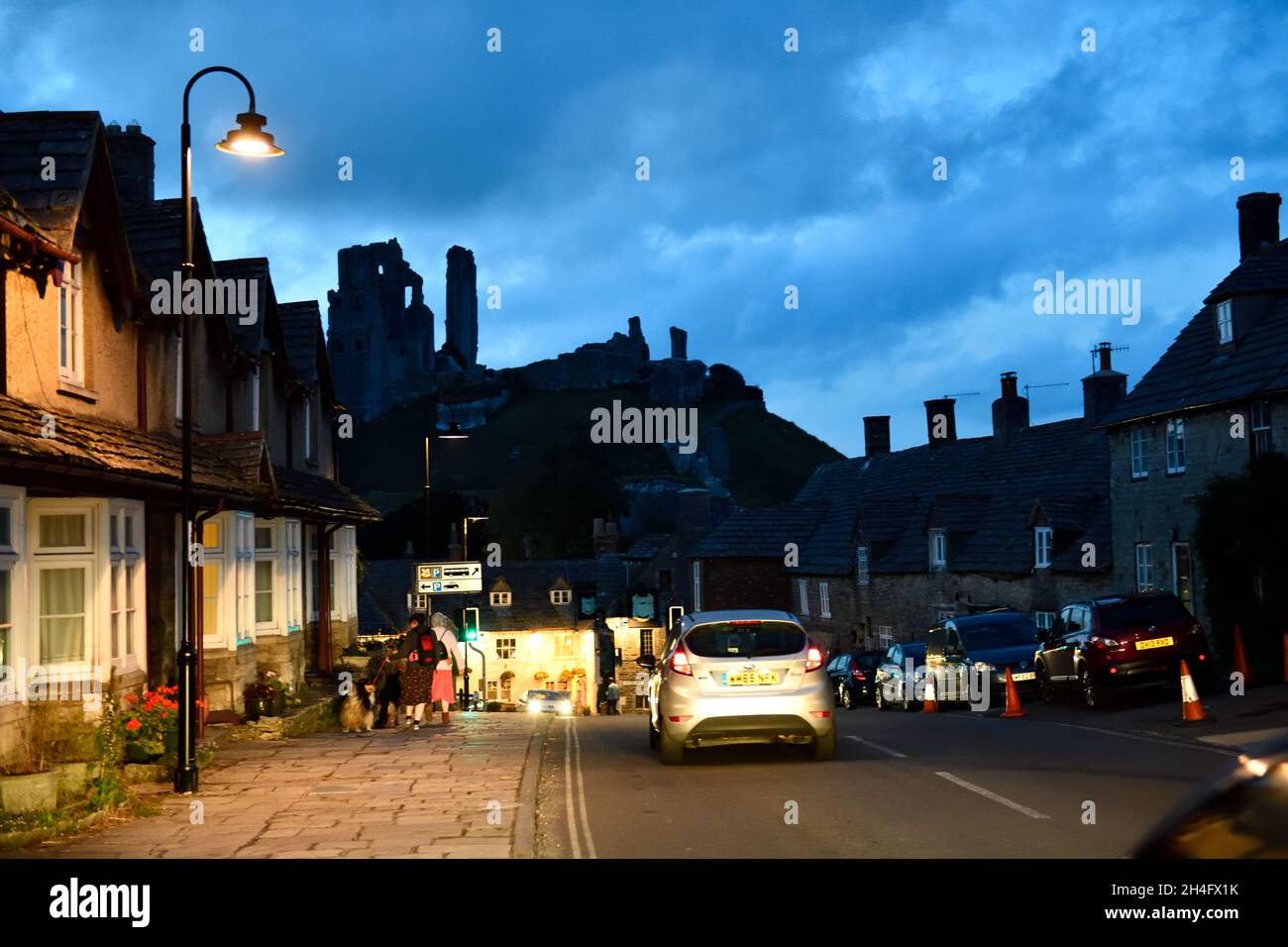 Corfe in the Evening on the Main Street with Corfe Castle in the ...