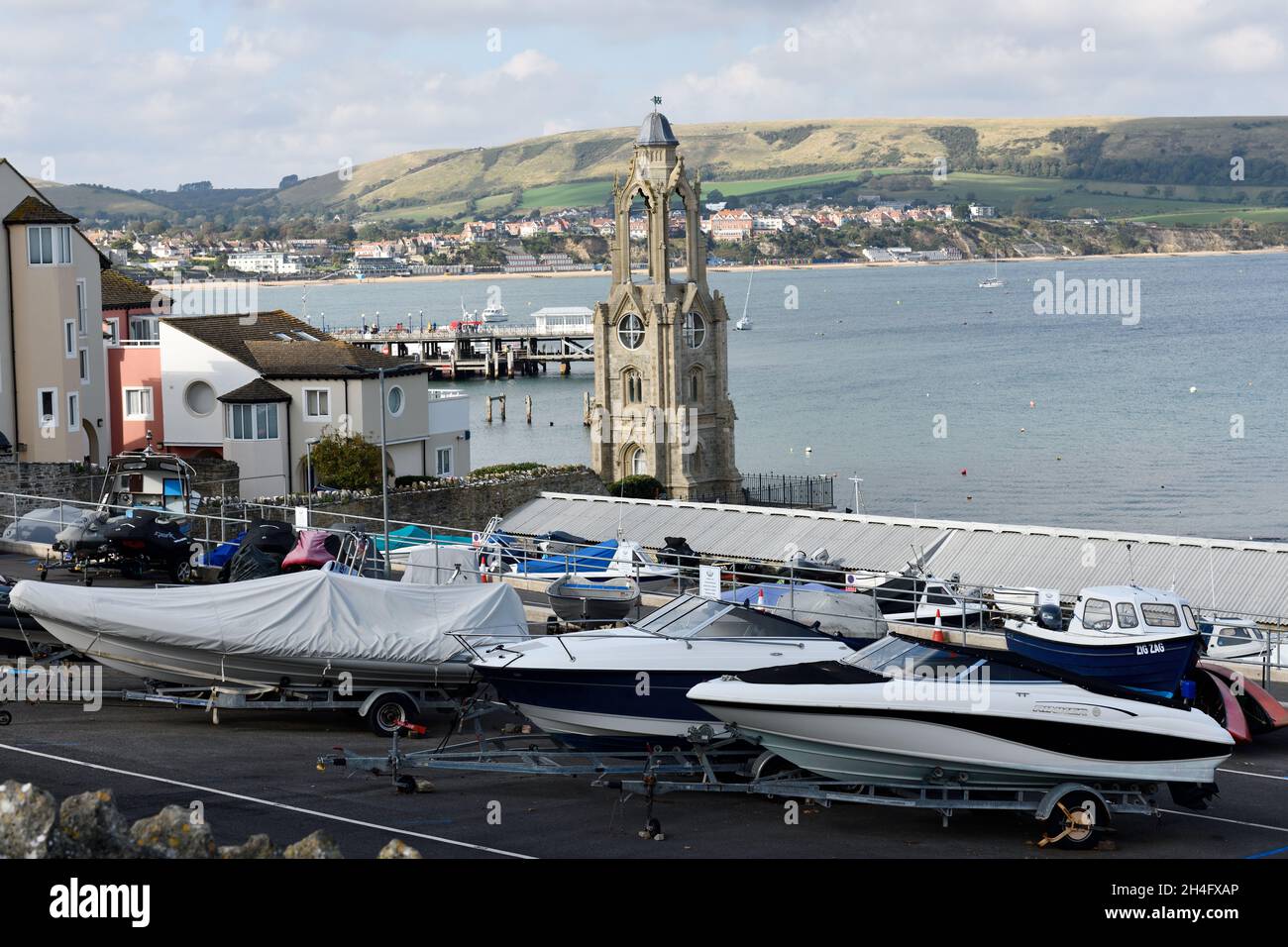 Wellington Clock Tower with speed Boats Swanage Dorset England uk Stock ...