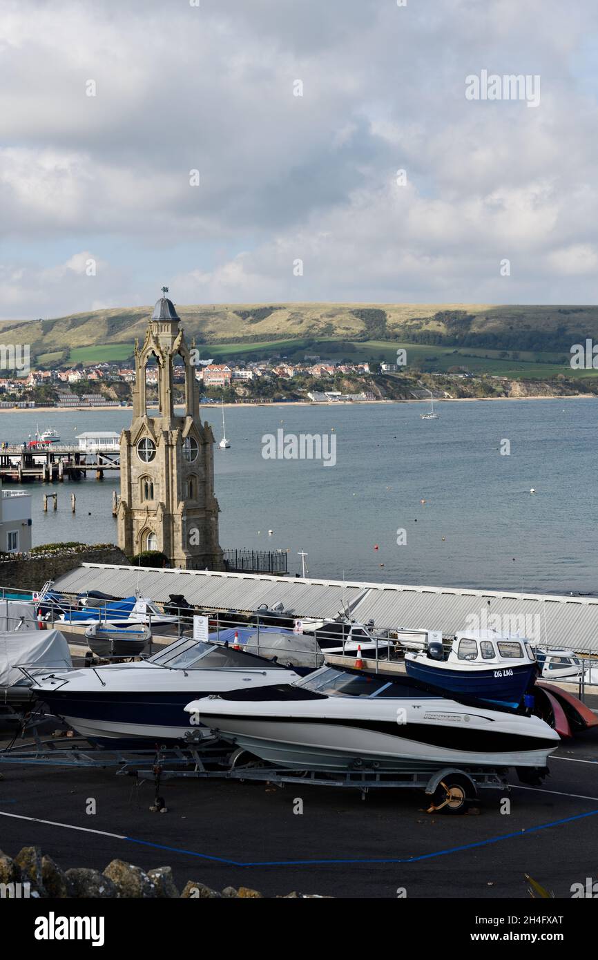 Wellington Clock Tower with speed Boats Swanage Dorset England uk Stock ...