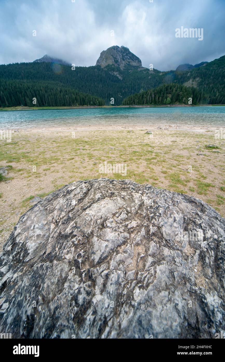 Reflecting the texture and shape of a large distant peak of Mount ...