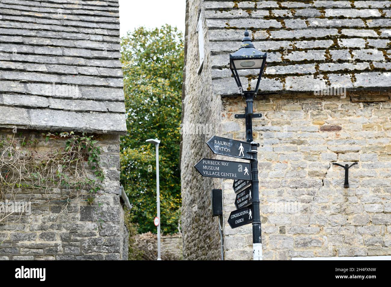 Sign Post and Street Lamp by the Road in Corfe Dorset England uk Stock ...