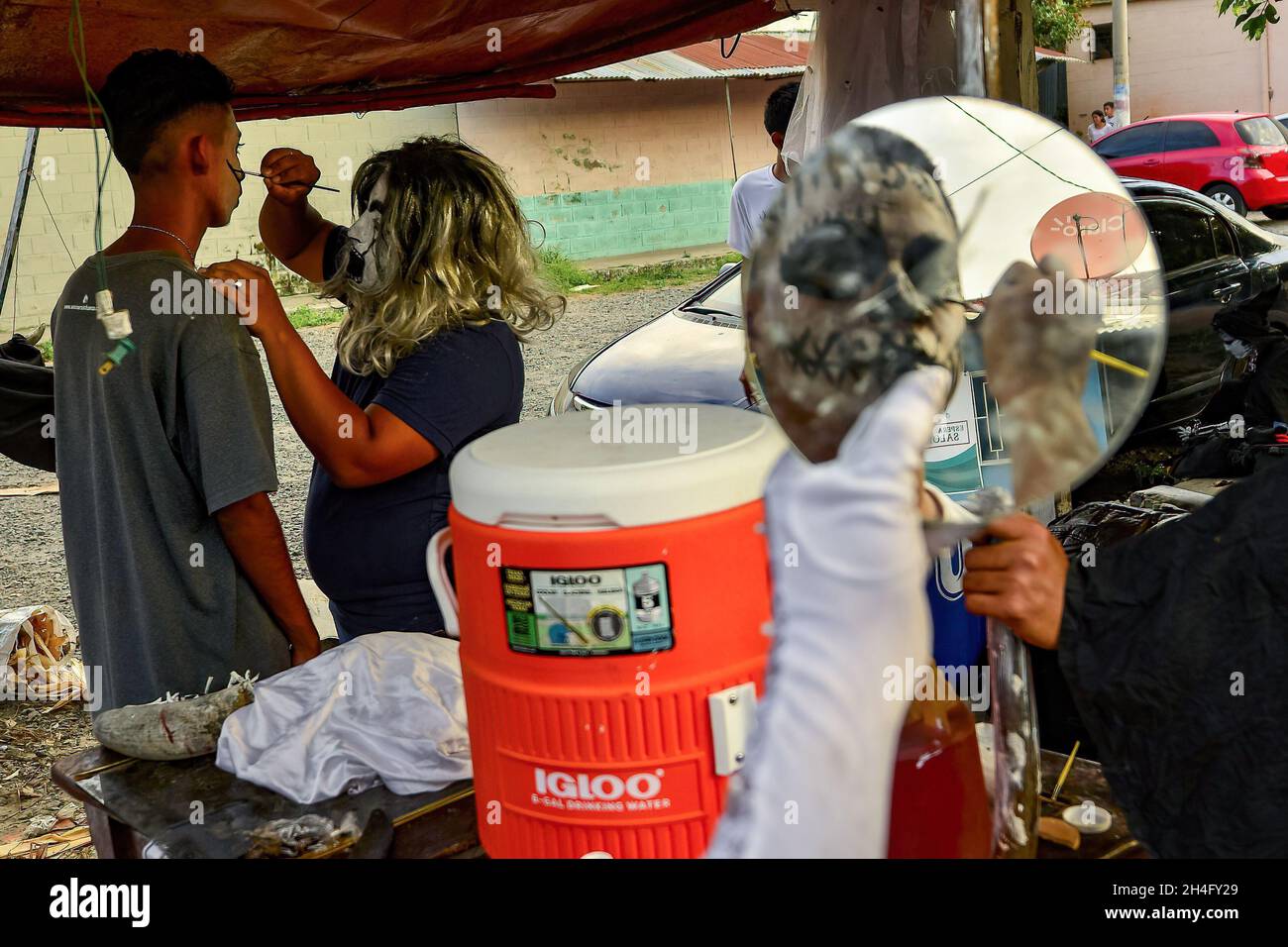 Tonacatepeque, El Salvador. 01st Nov, 2021. Revellers put on make up ...