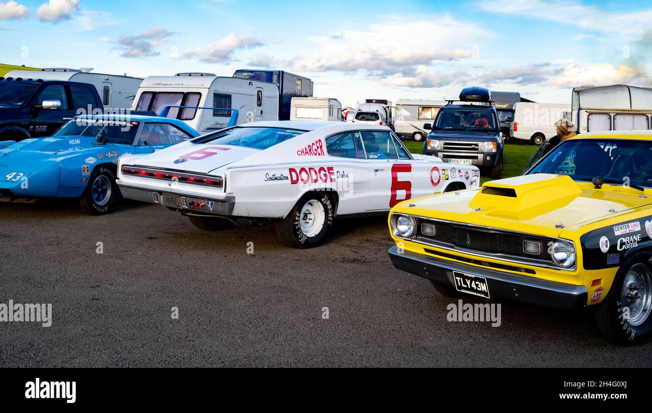 Classic American muscle drag racing cars in the pit at the Santa Pod ...