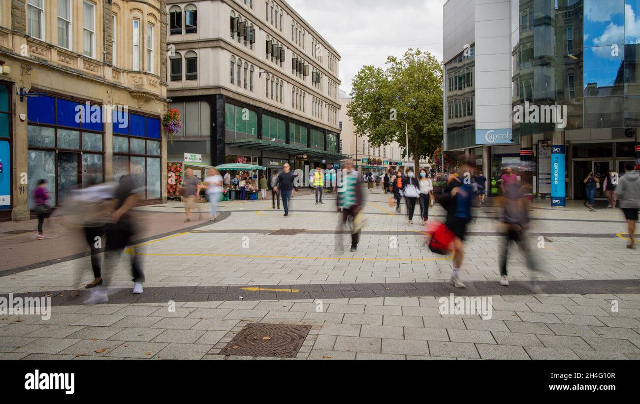 CARDIFF, WALES - SEPTEMBER 16 2021: Long exposure image of shoppers in ...