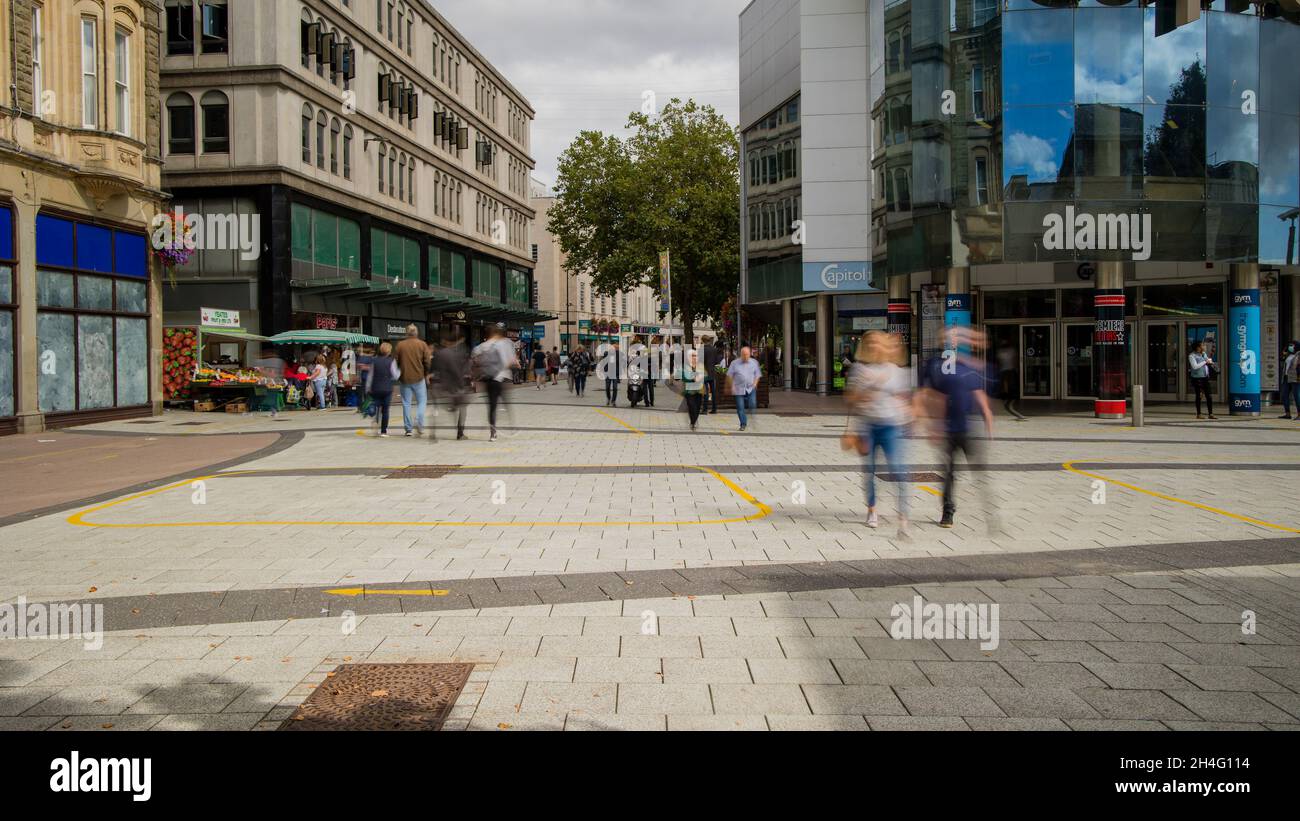 CARDIFF, WALES - SEPTEMBER 16 2021: Long exposure image of shoppers in ...