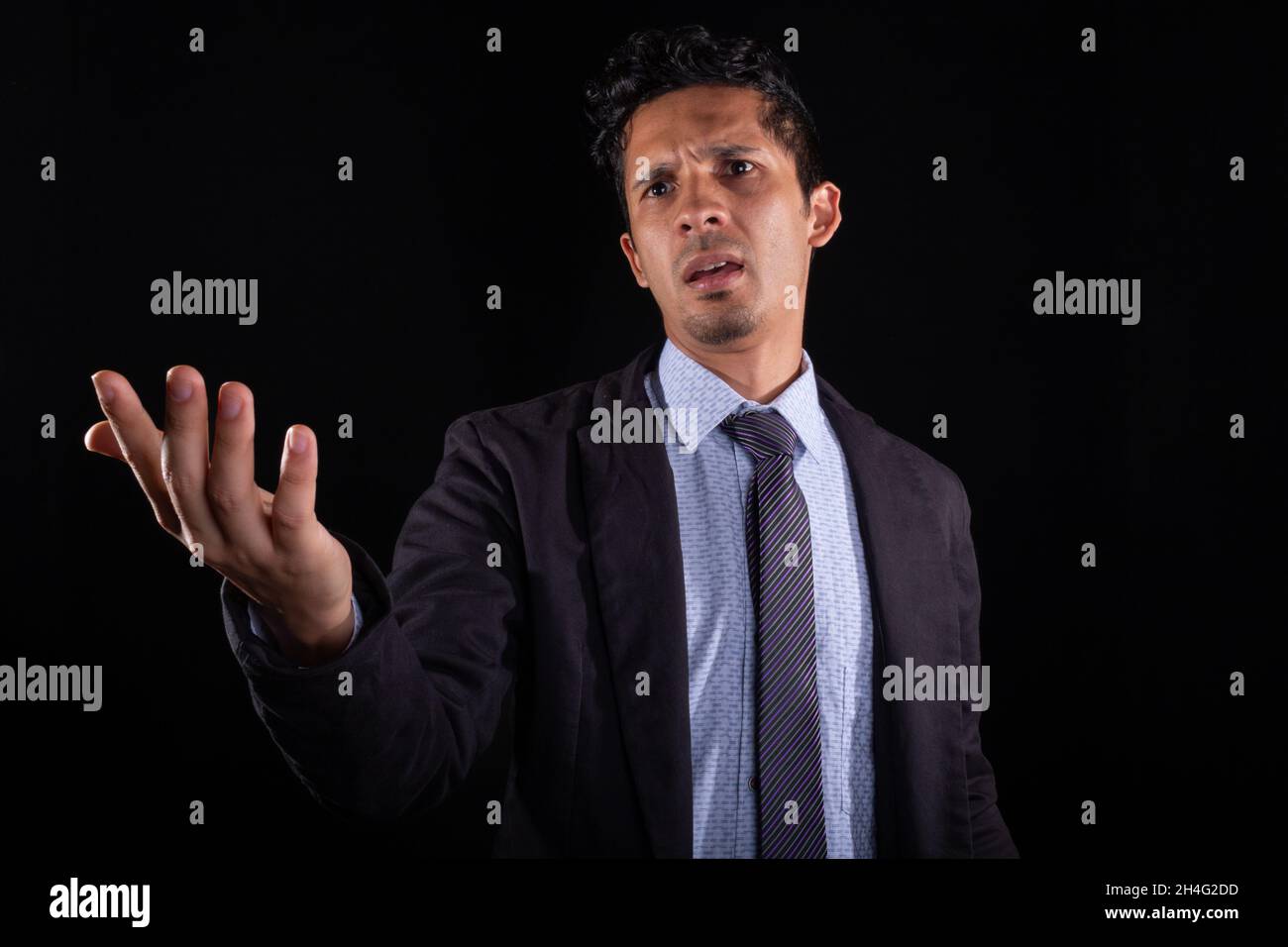 An angry businessman filing a complaint. Young adult can't believe his ...