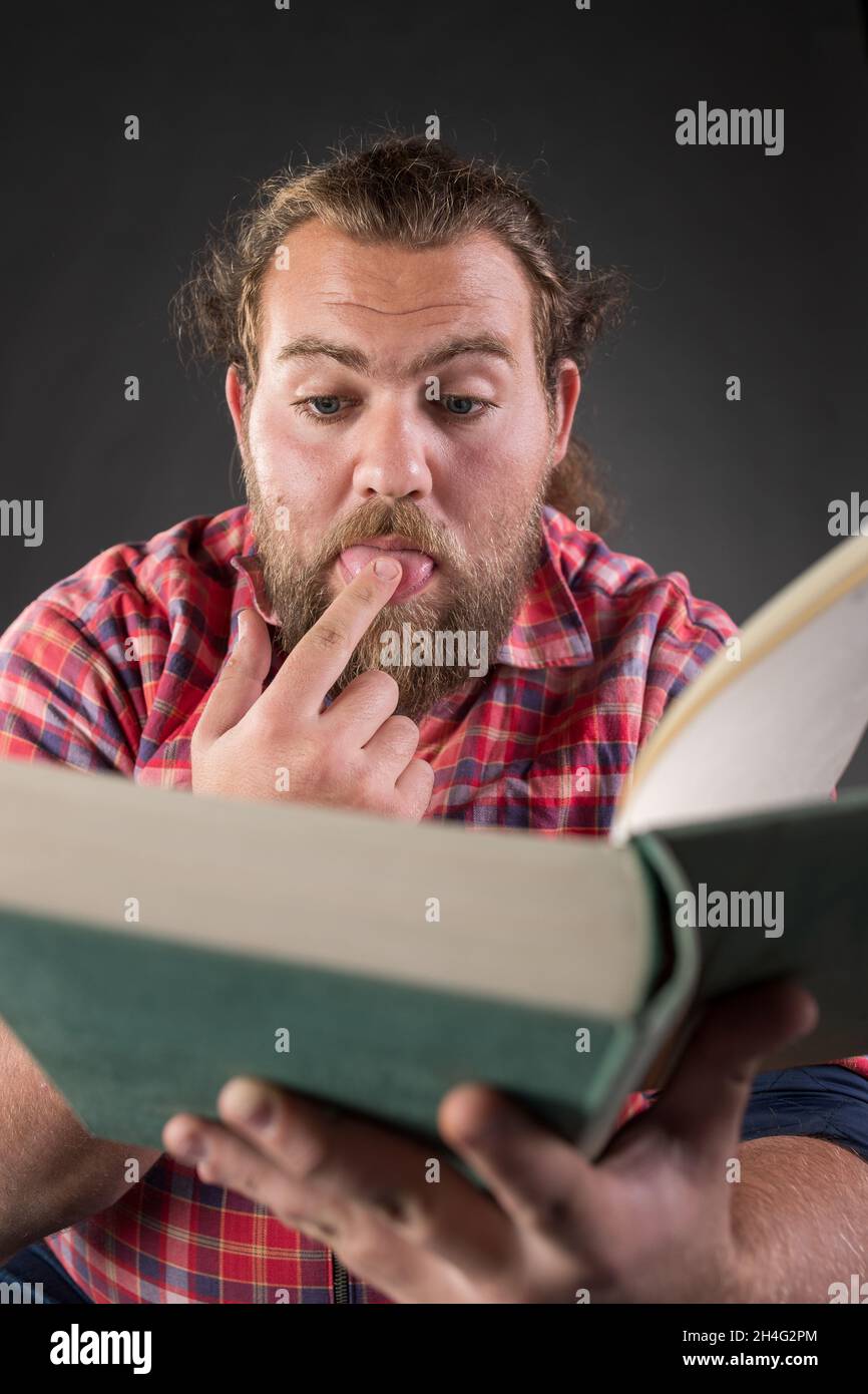 Adult confused reading book hi-res stock photography and images - Alamy