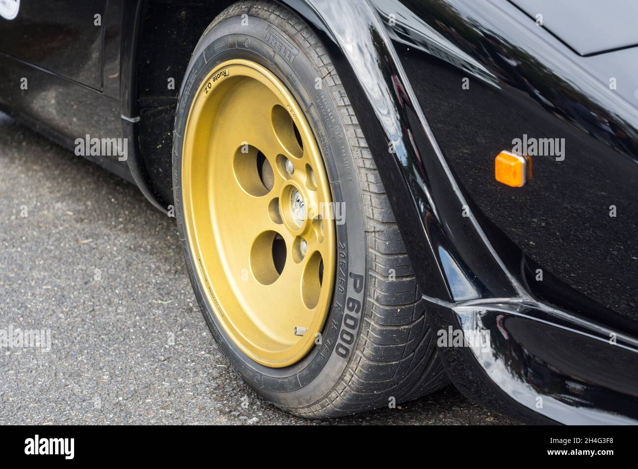 Close up detail of a gold Campagnolo alloy front wheel on a Lamborghini ...