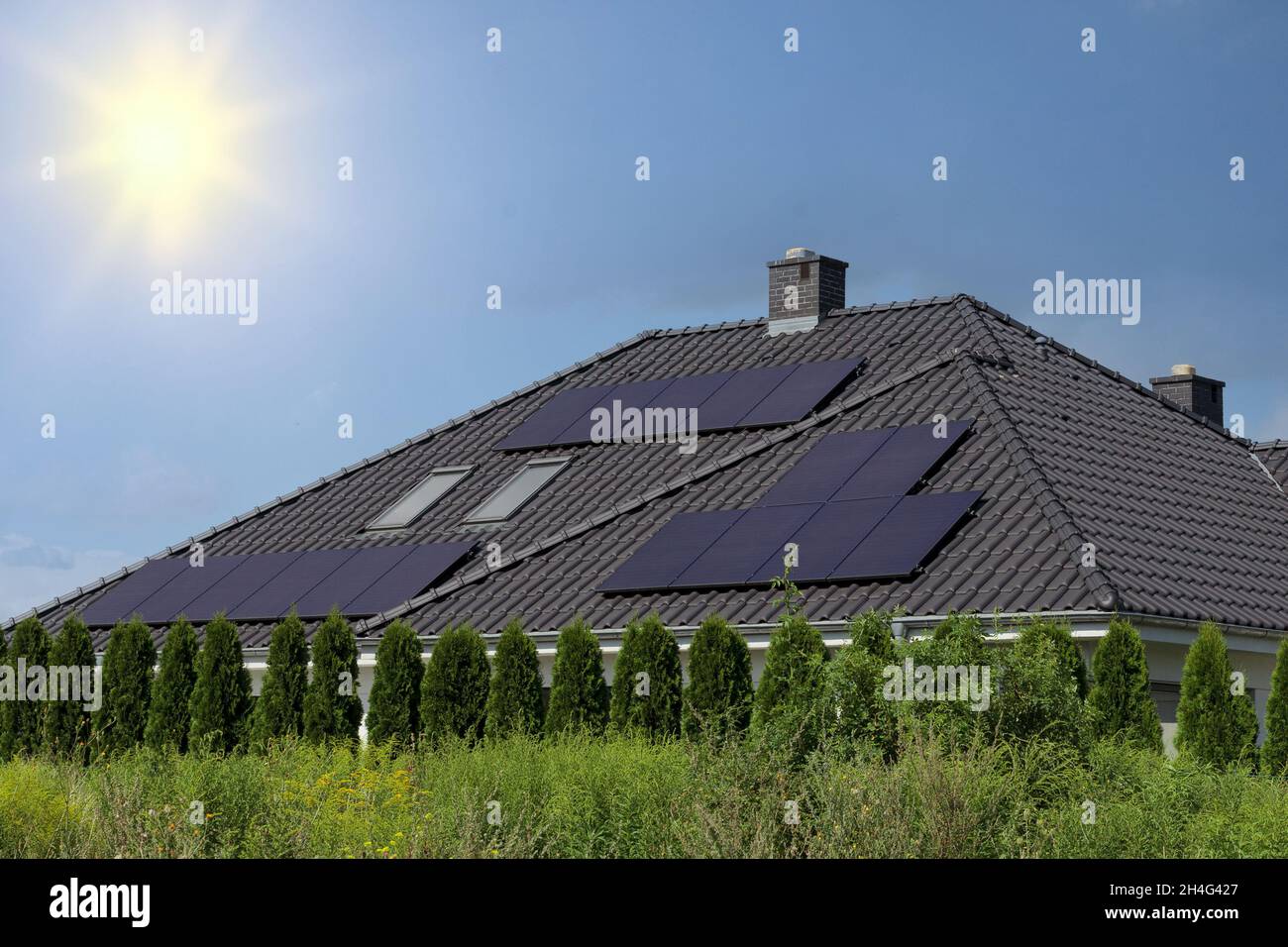 Big house with solar panels on the roof Stock Photo - Alamy