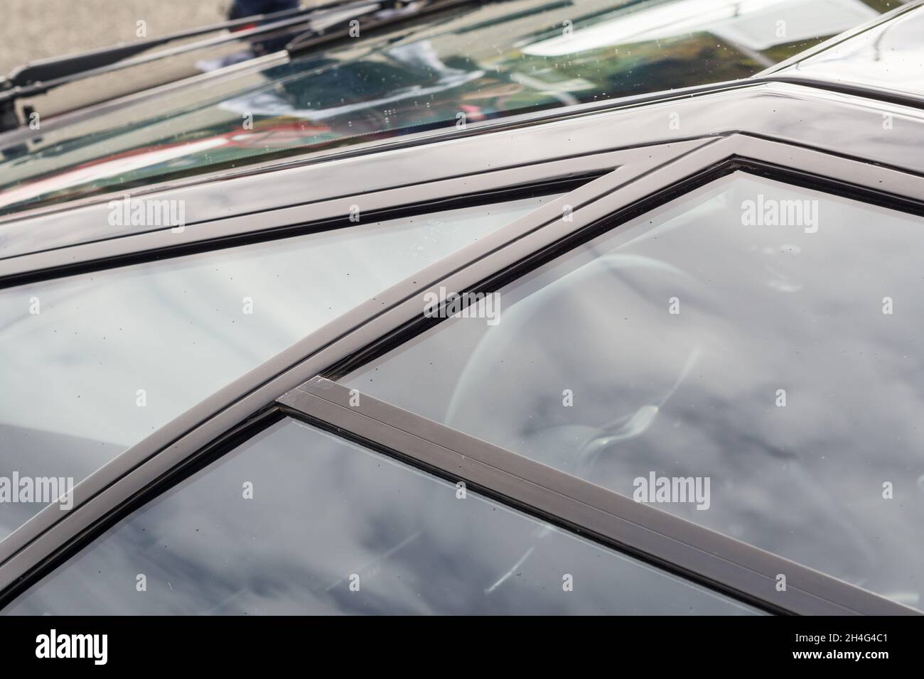 Close up of the door window glass on a black Lamborghini Countach ...