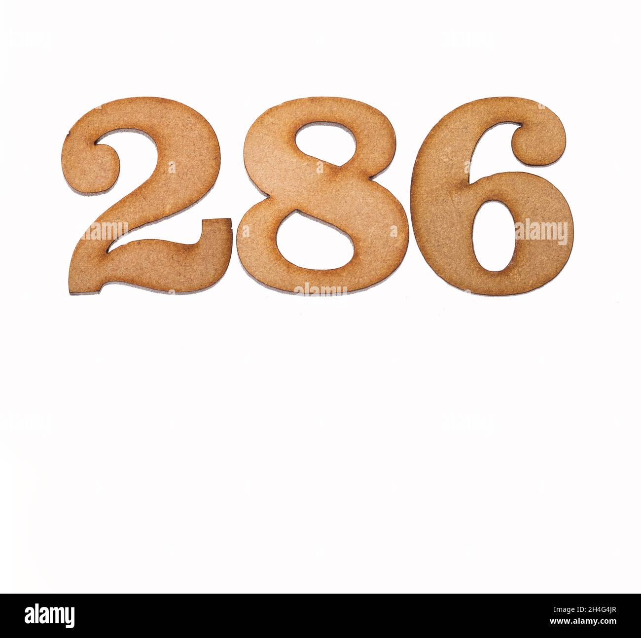 Number 286 in wood, isolated on white background Stock Photo - Alamy
