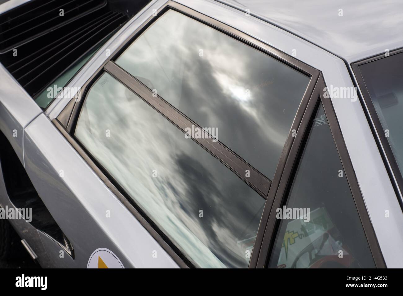Close up detail of the right scissor door windows on a silver ...