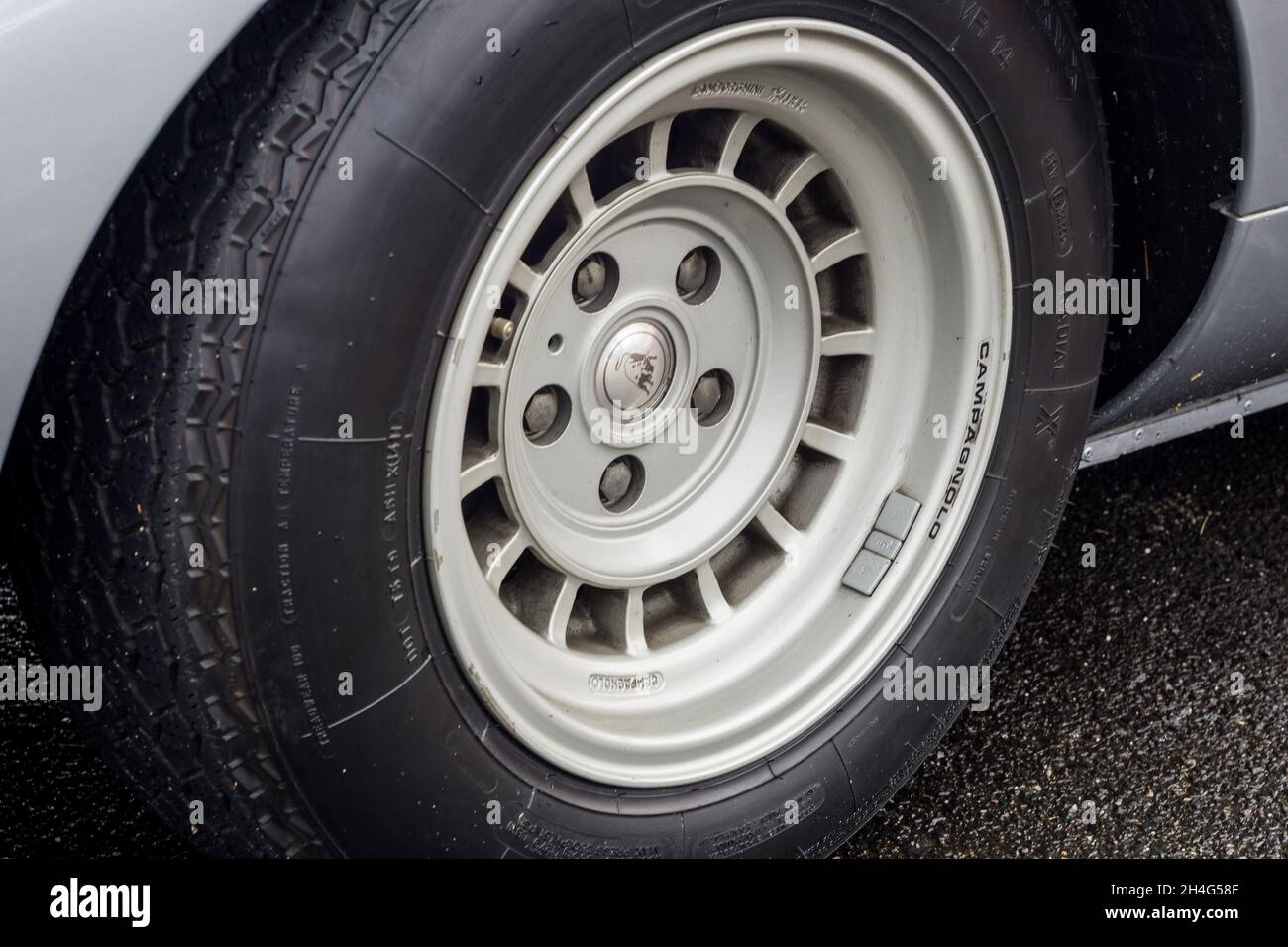 Close up detail of the Campagnolo alloy wheel and arch on a silver ...