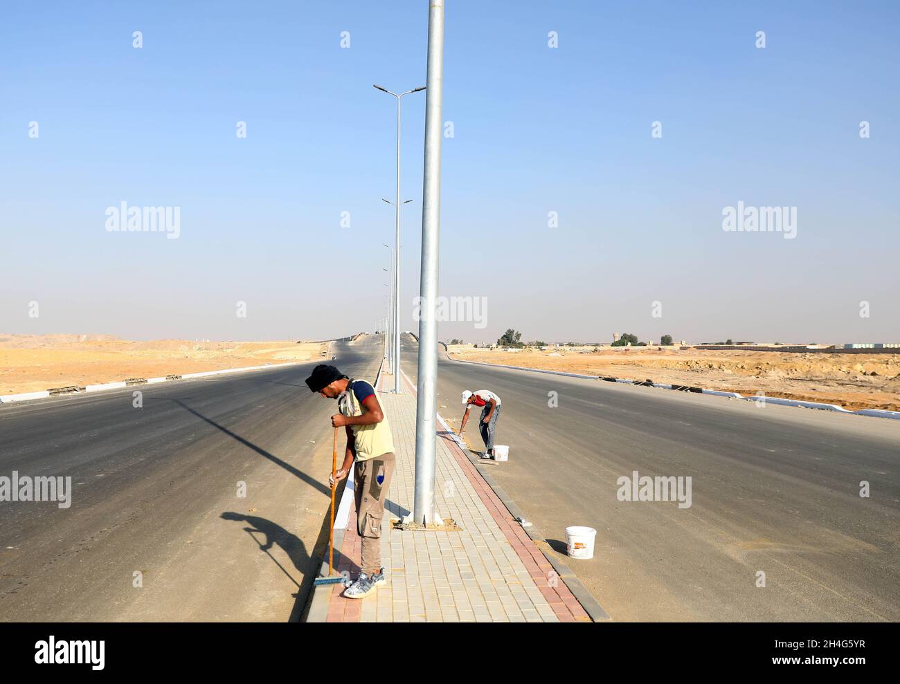 Cairo, Egypt. 2nd Nov, 2021. People work on a newly-built highway in ...