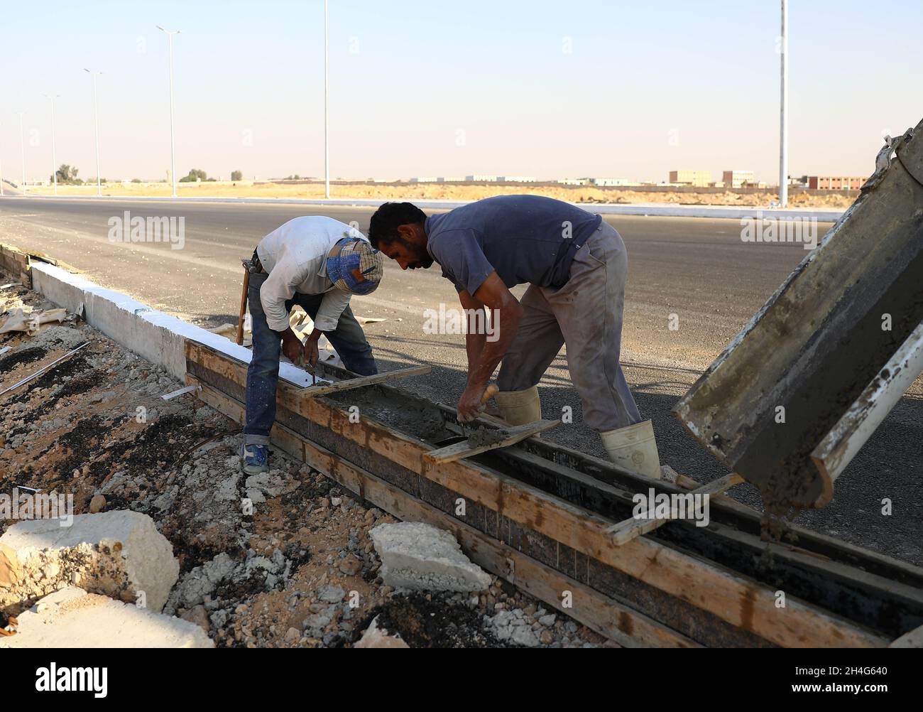 Cairo, Egypt. 2nd Nov, 2021. People work on a newly-built highway in ...