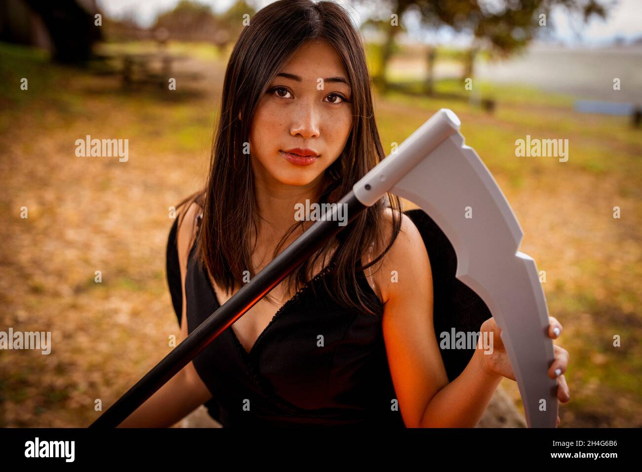 Young Woman Wearing a Grim Reaper Cosplay Outfit in the Woods Stock ...