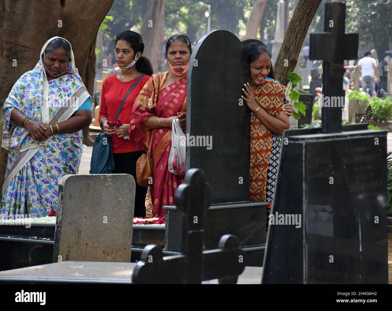 Mumbai, India. 02nd Nov, 2021. A woman seen crying at a graveyard on ...