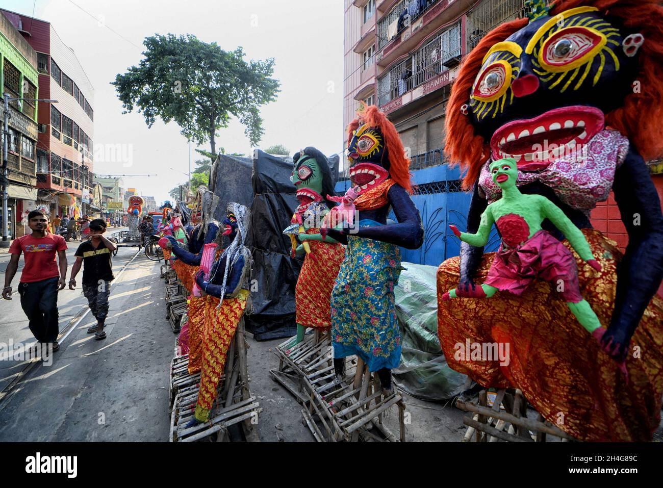 Kolkata, India. 02nd Nov, 2021. People seen passing by the Demon clay ...