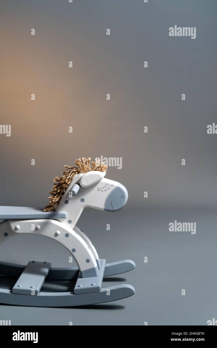 Handmade rocking horse on a gray background Stock Photo - Alamy