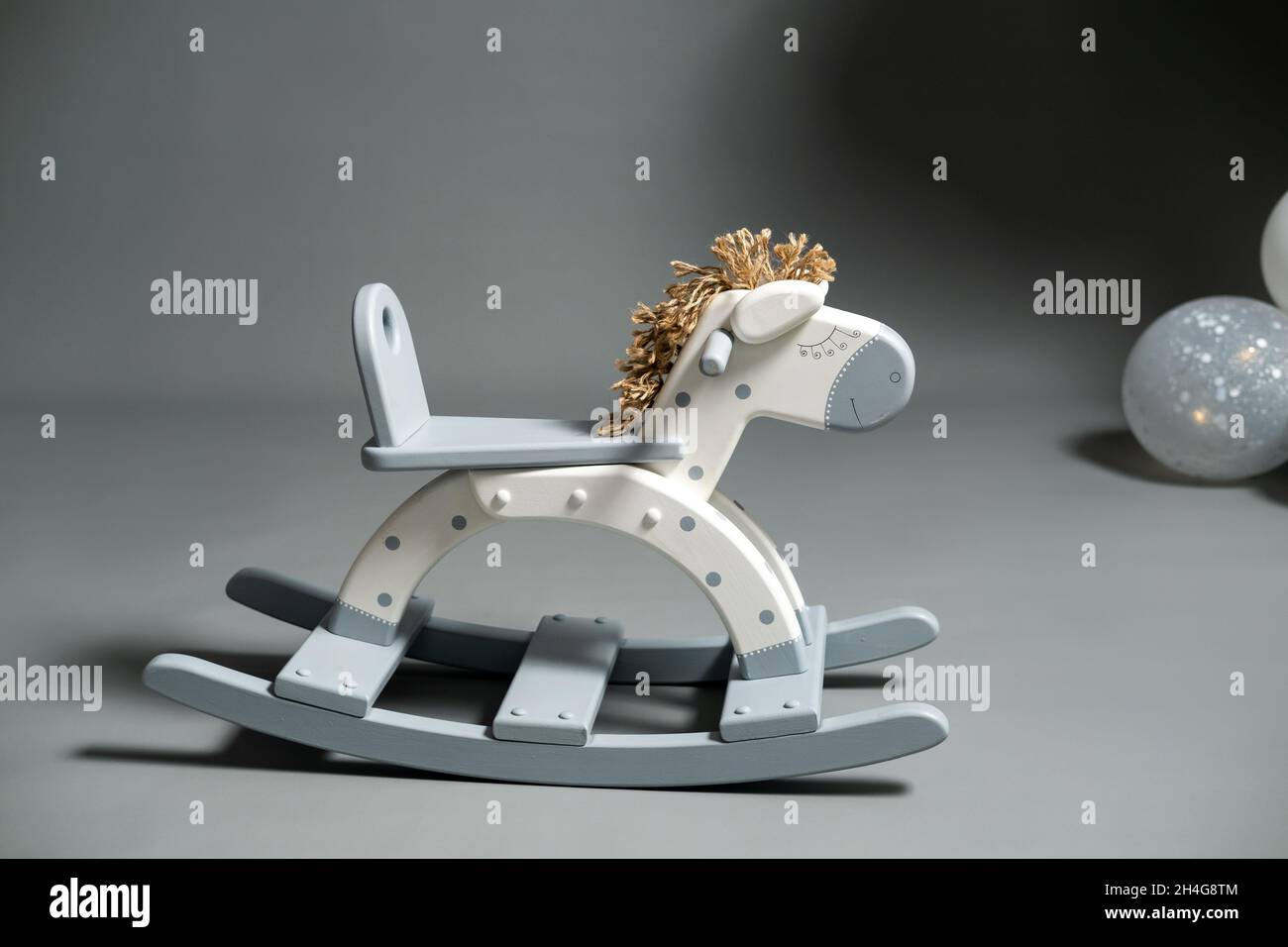 Handmade rocking horse on a gray background Stock Photo - Alamy
