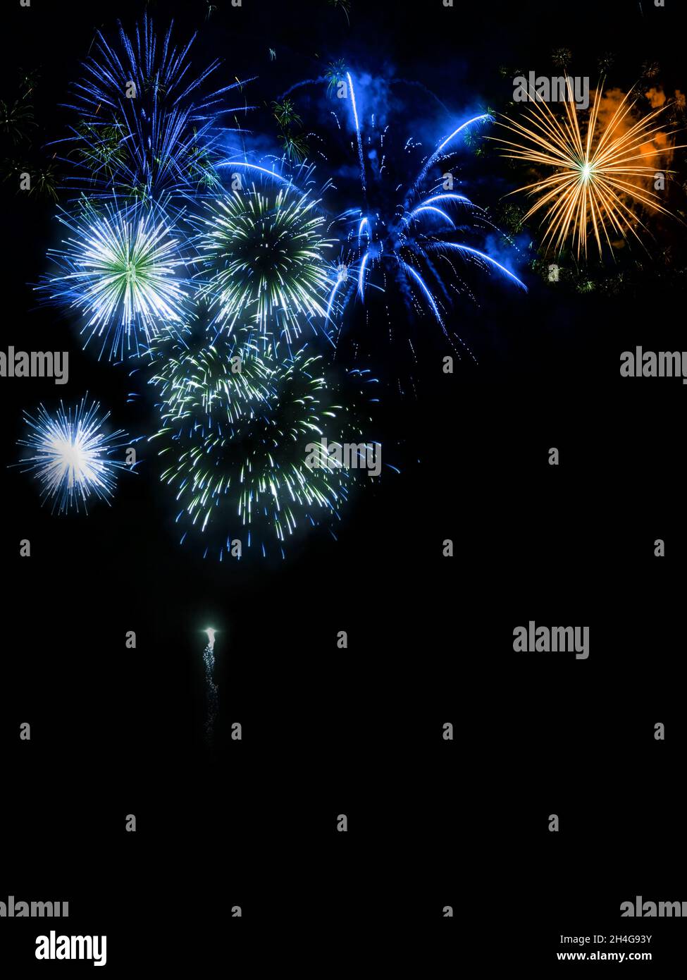 Dazzling firework exploding in the night sky Stock Photo - Alamy