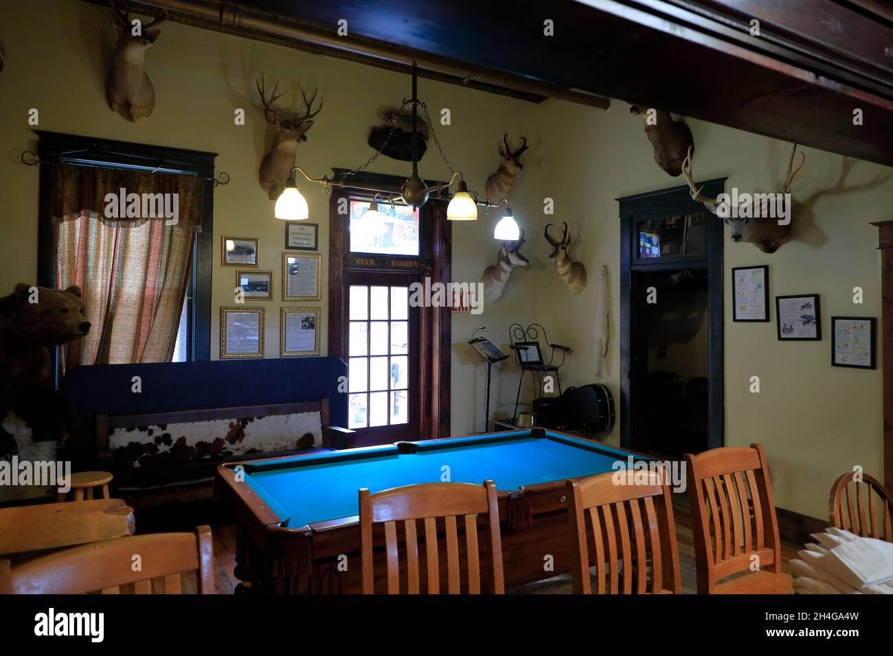 Billiard room with taxidermied animal heads in historic Occidental ...