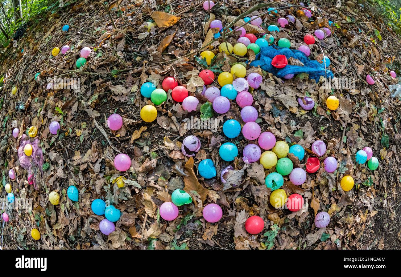 Discarded damaged coloured plastic balls in a forest setting Stock ...