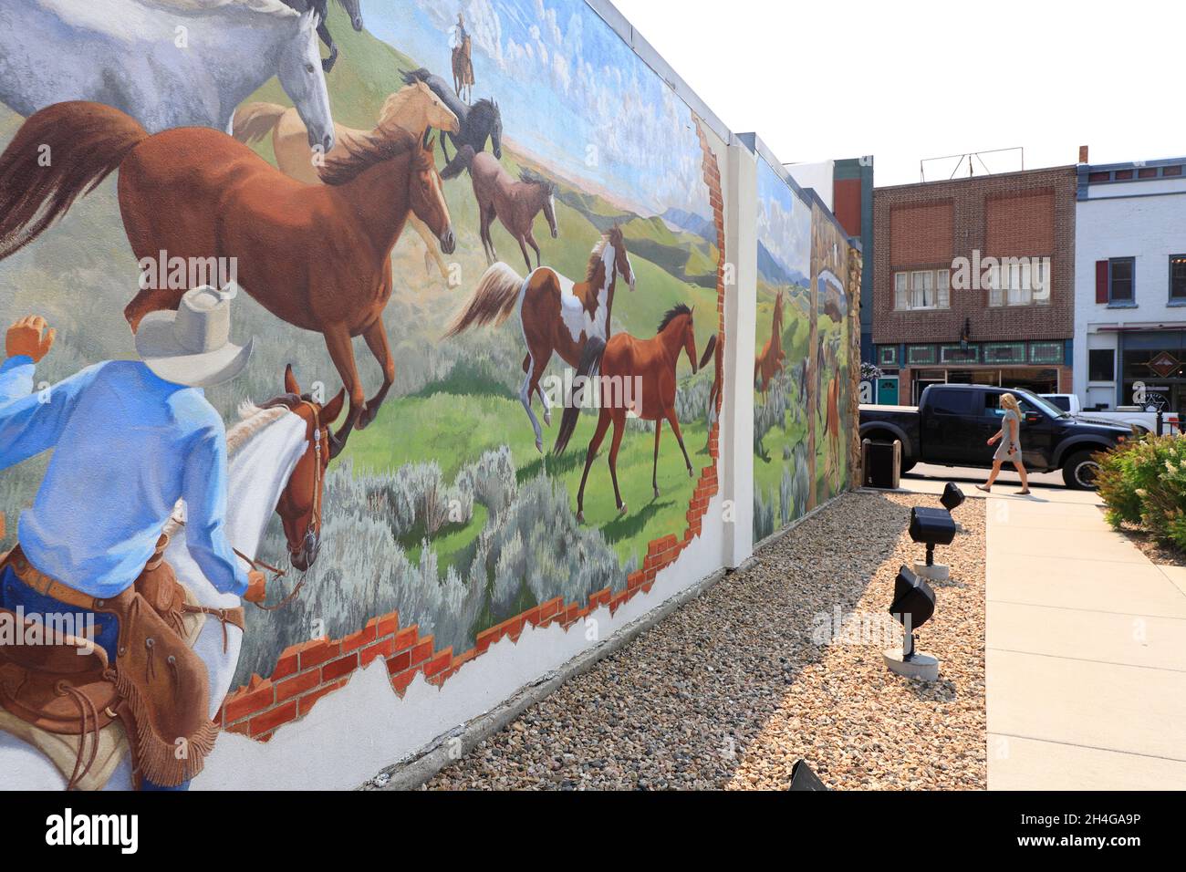 Downtown historic district of Buffalo with cowboy and horses mural ...