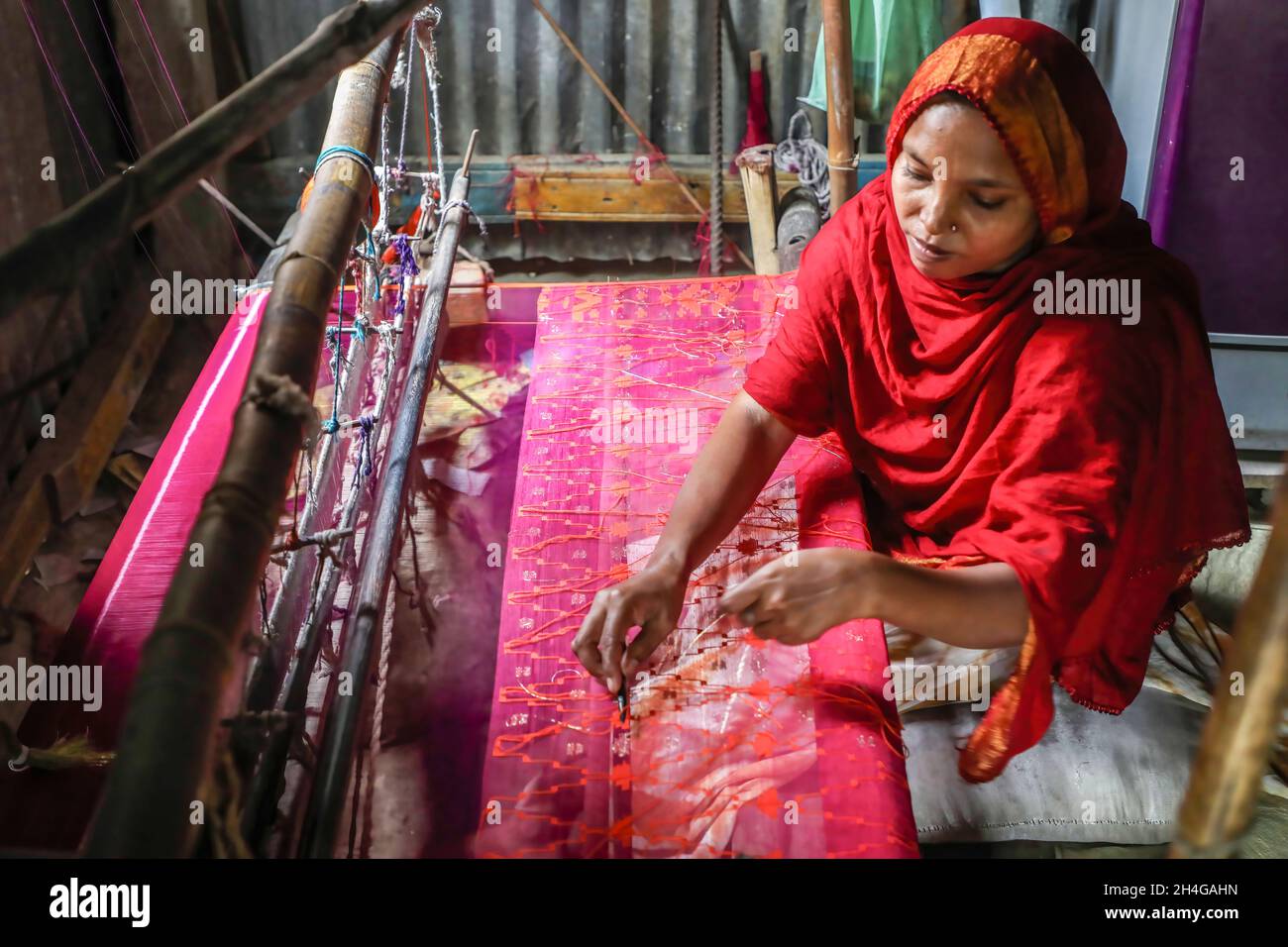 A women seen making Jamdani saree at Demra Jamdani Palli. Jamdani is ...