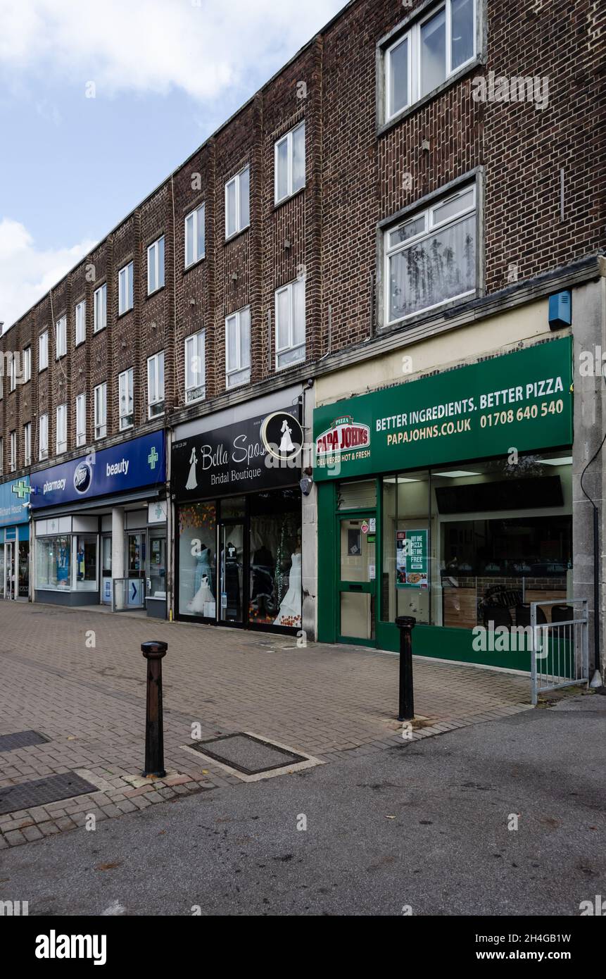 High street shops with apartments above, along Corbets Tey Road in ...