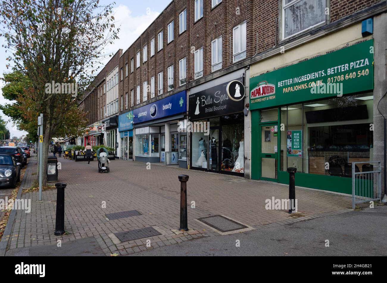 High street shops with apartments above, along Corbets Tey Road in ...