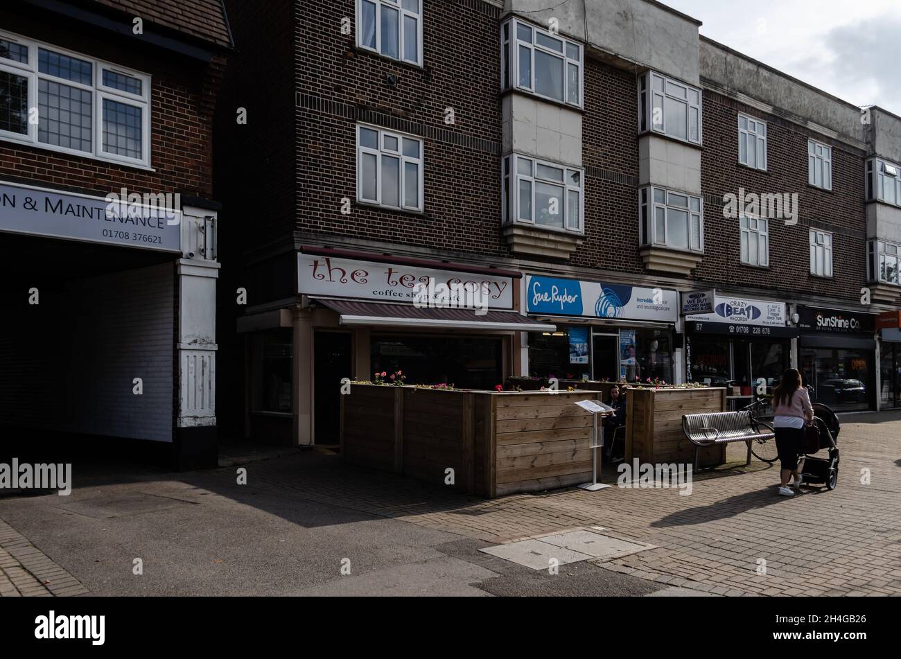 High street shops with apartments above, along Corbets Tey Road in ...