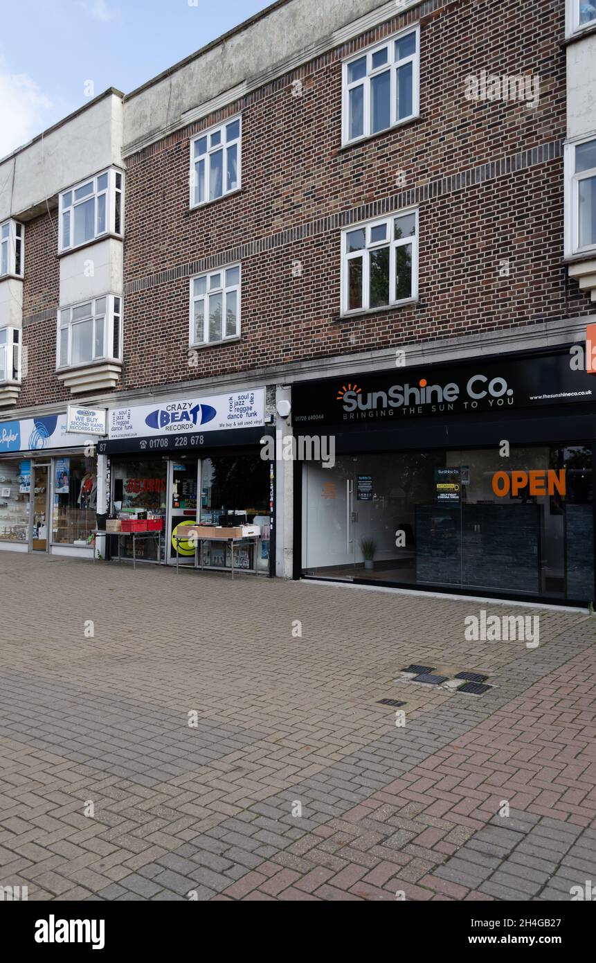 High street shops with apartments above, along Corbets Tey Road in ...