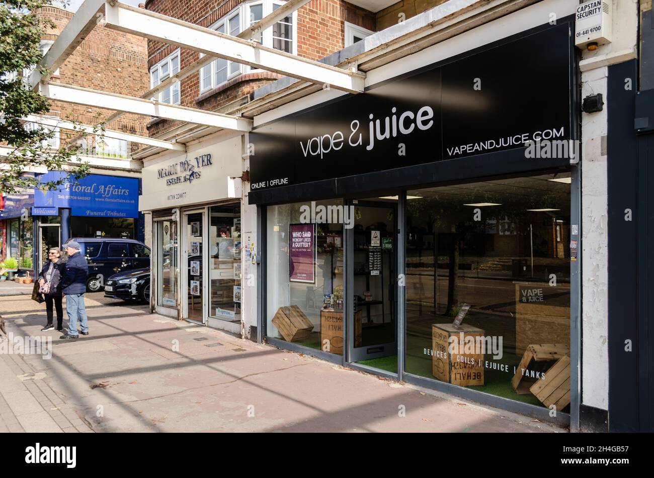 High street shops with apartments above, along Corbets Tey Road in ...