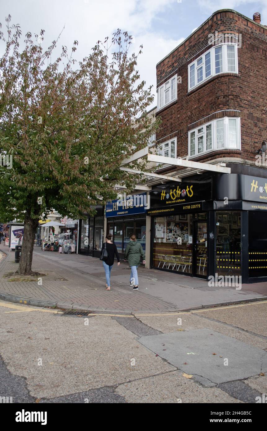 High street shops with apartments above, along Corbets Tey Road in ...
