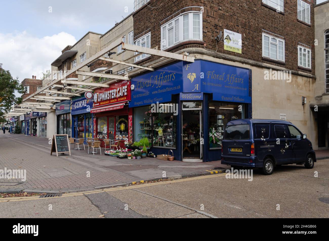 High street shops with apartments above, along Corbets Tey Road in ...