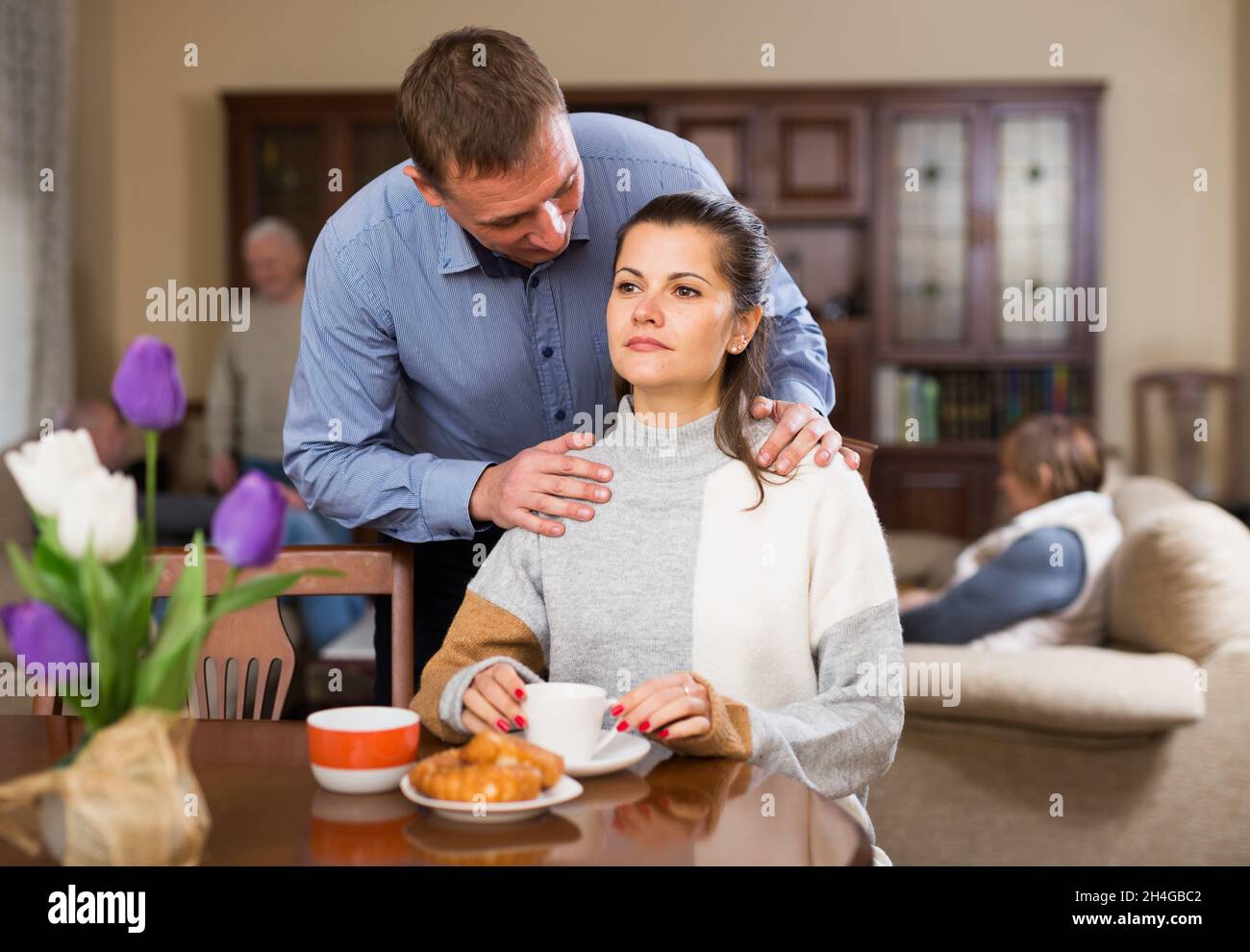 Couple drinking tea at parents home Stock Photo - Alamy