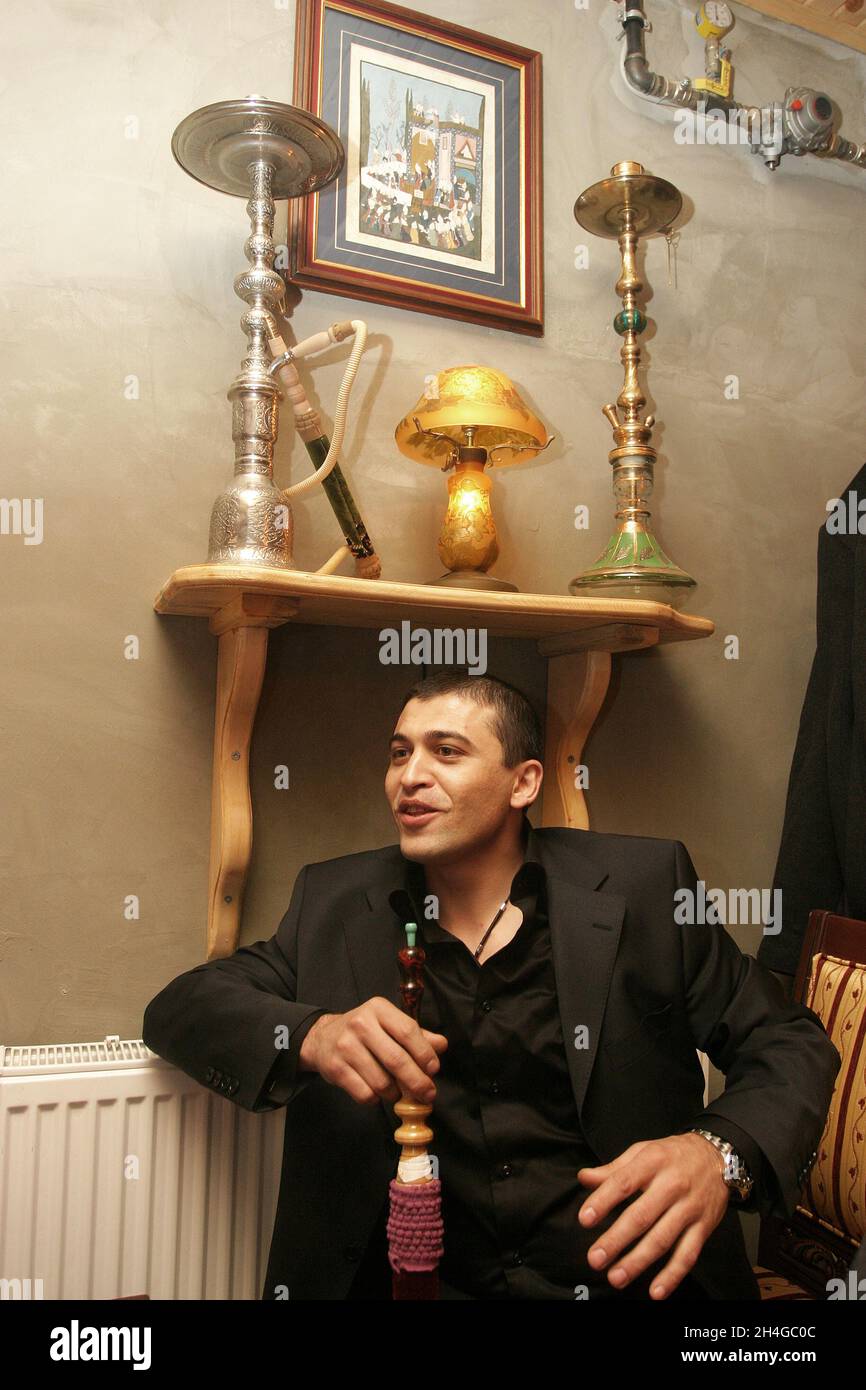 ISTANBUL, TURKEY - JANUARY 5: Man smoke hookah (Nargile) on January 5 ...