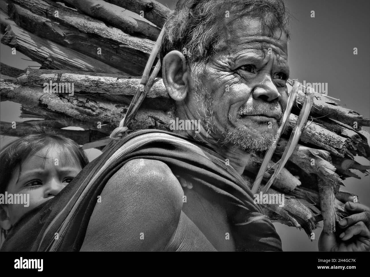 Grandfather carrying child Black and White Stock Photos & Images - Alamy