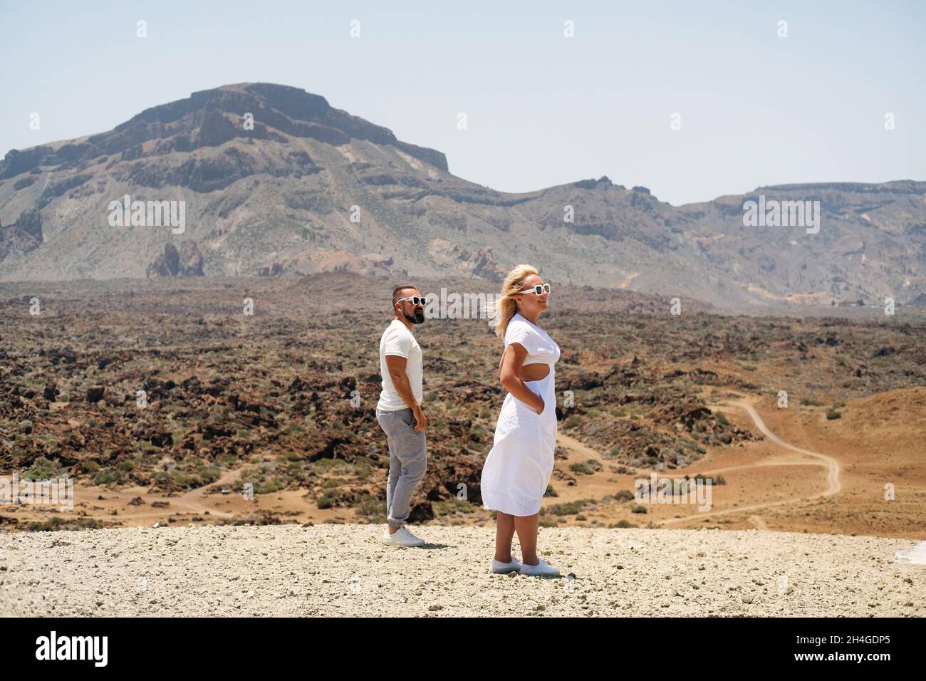 A couple in love stands in the crater of the Teide volcano.Tenerife ...