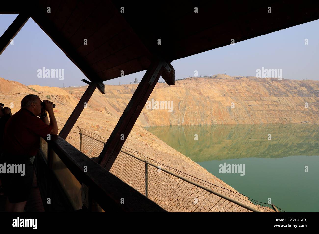 Visitors at viewing platform looking at Berkeley Pit, an open pit ...